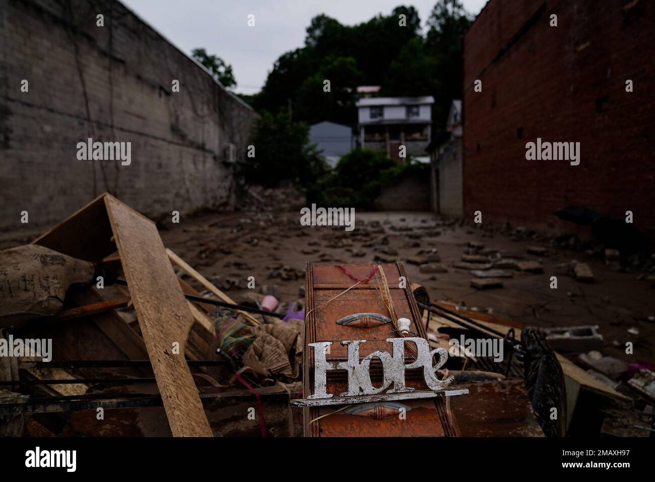 A "hope" sign sits atop a pile of debris on Friday, Aug. 5, 2022, after ...