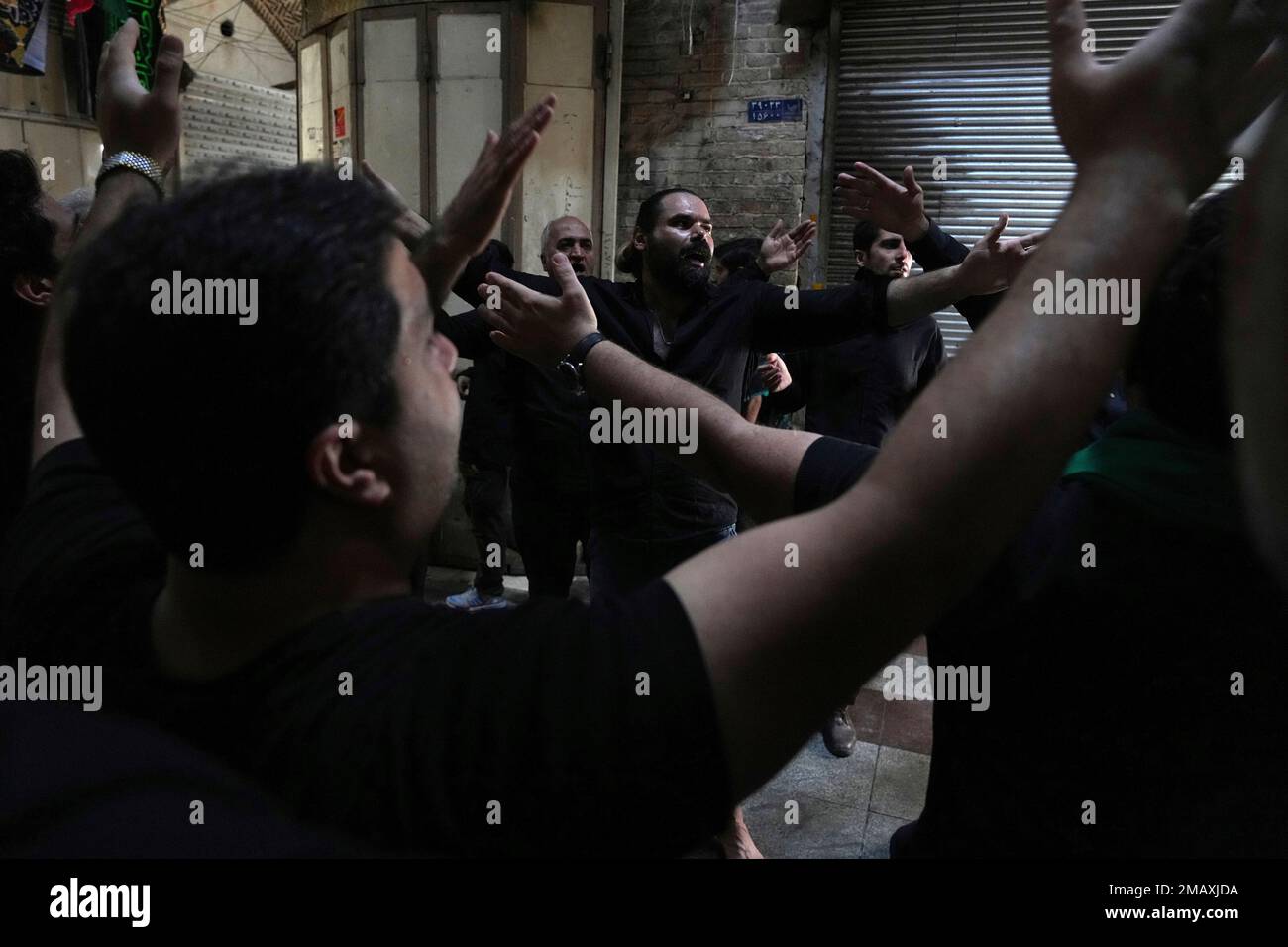 Mourners strike their chests during an annual procession commemorating ...