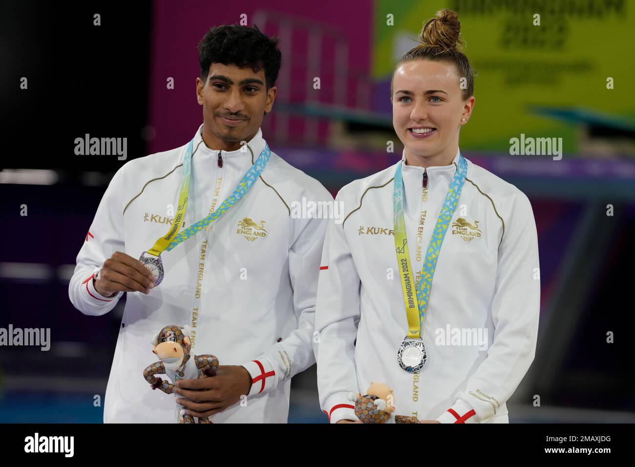 England's Lois Toulson, right and Kyle Kothari pose with their silver ...