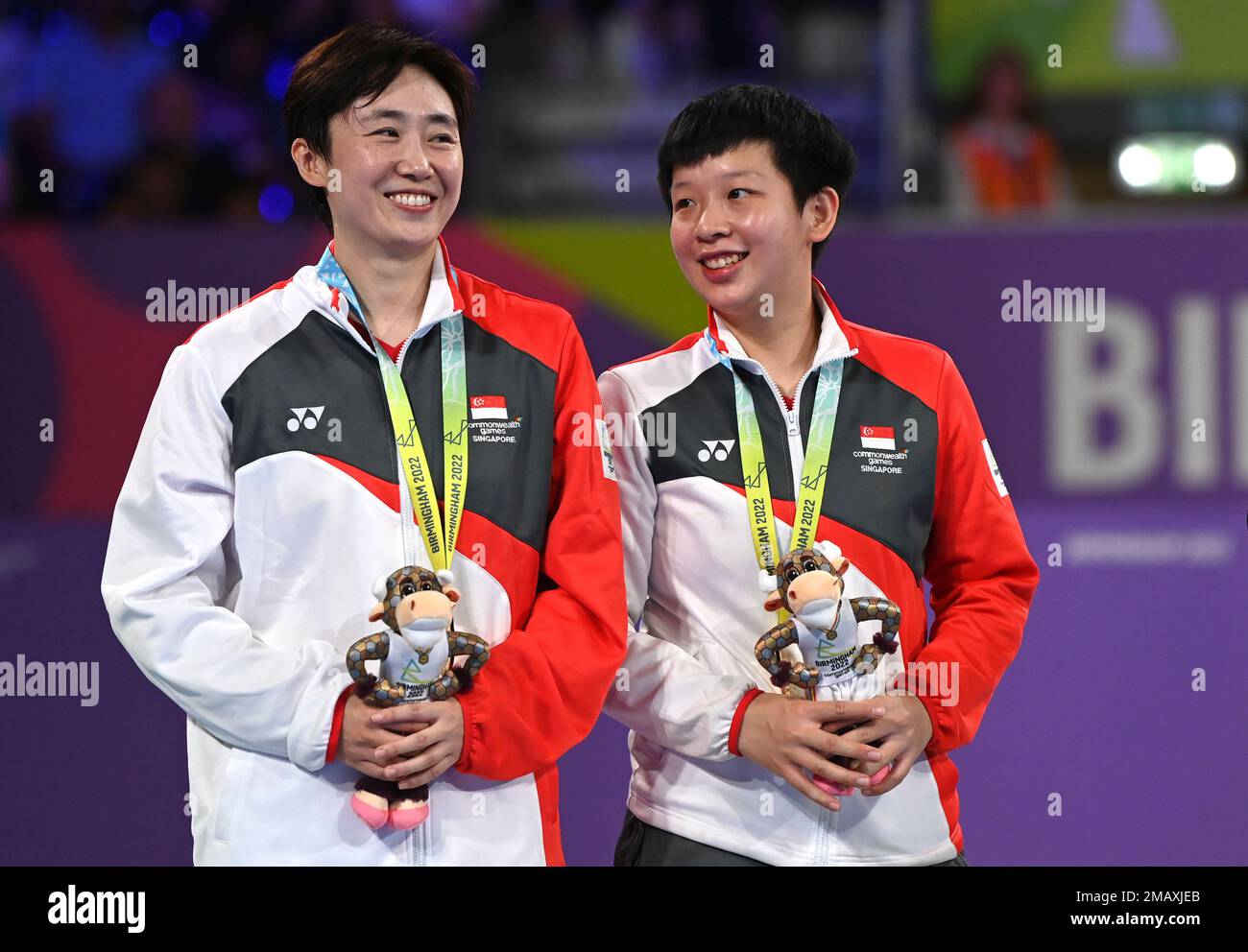 Singapore's Tianwei Feng, left, and Jianose Zeng pose with their gold ...