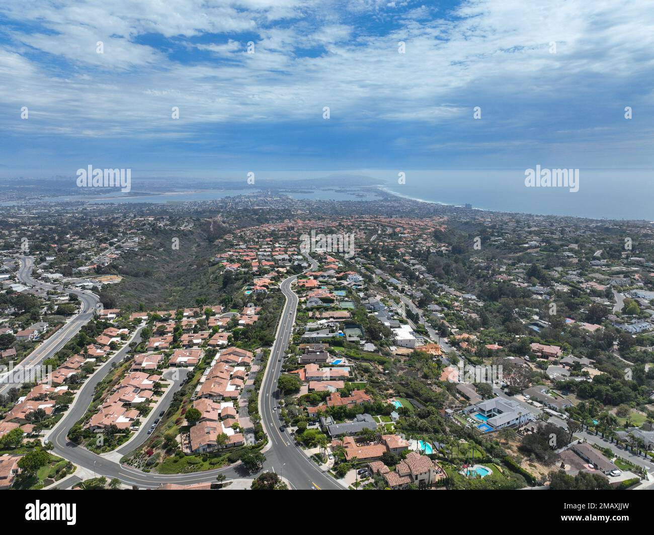 Aerial view over La Jolla Hills with big villas and ocean in the ...