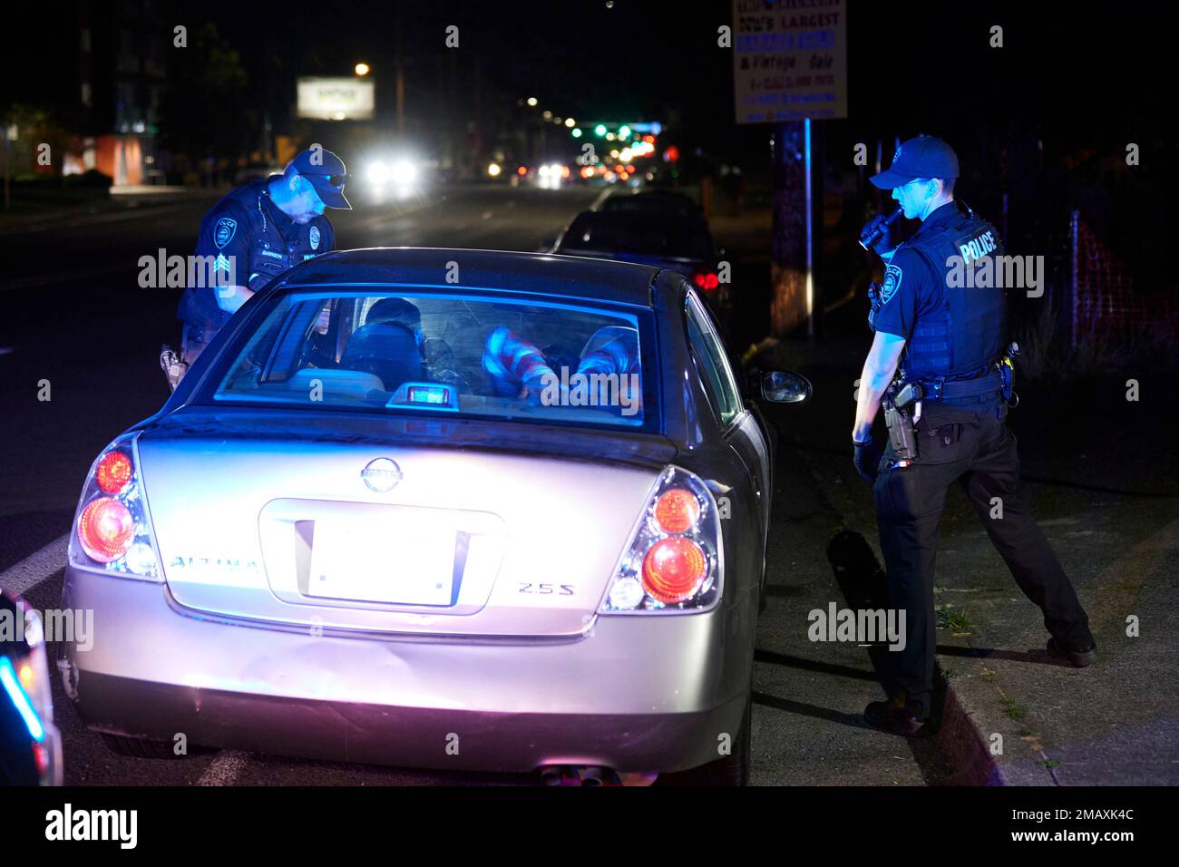 Gresham Police Sgt. Travis Garrison, left, and Officer Ryan Gomez look ...