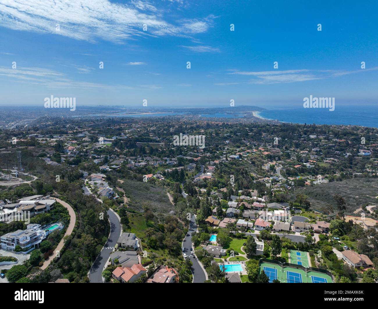 Aerial view over La Jolla Hills with big villas and ocean in the ...
