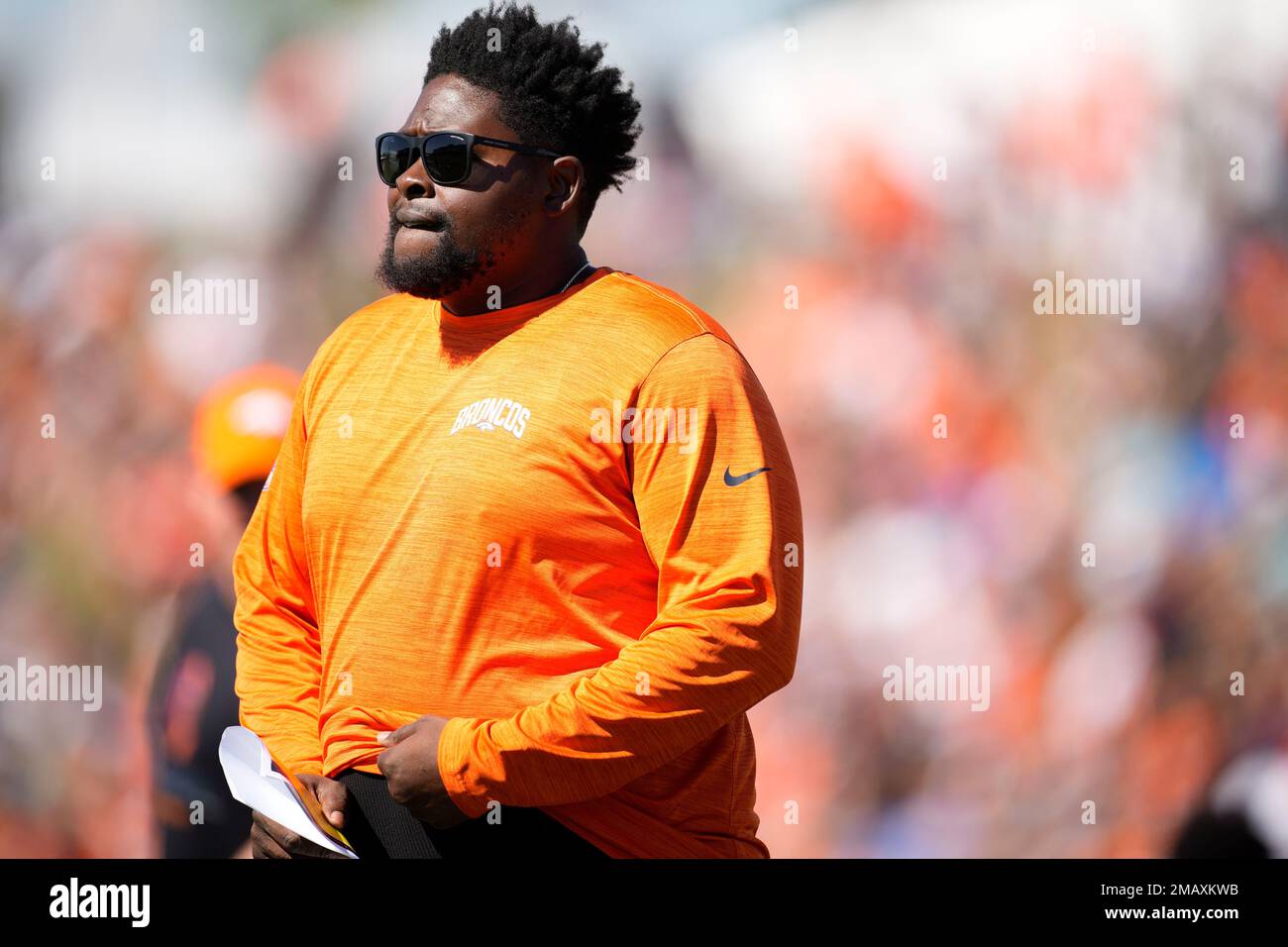 Denver Broncos defensive quality control coach A.C. Carter takes part ...