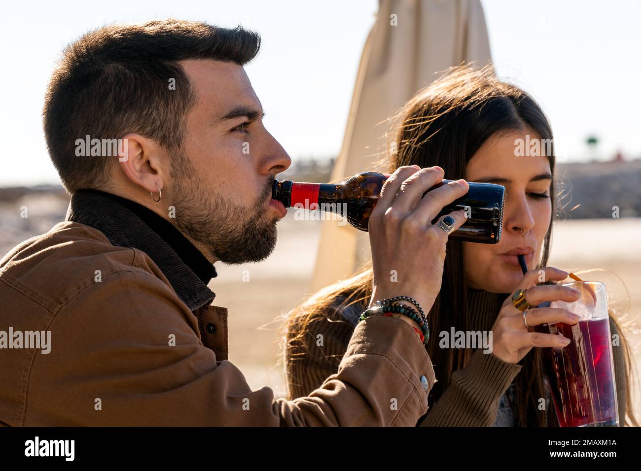 Sipping drink through straw hi-res stock photography and images - Alamy