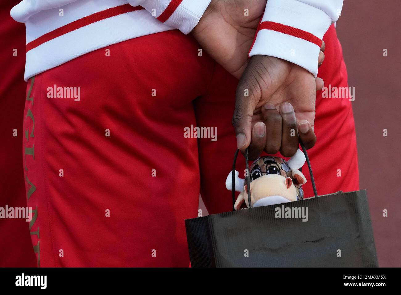 A member of England's Men's 4 x 100m relay team carries a pair bag with ...