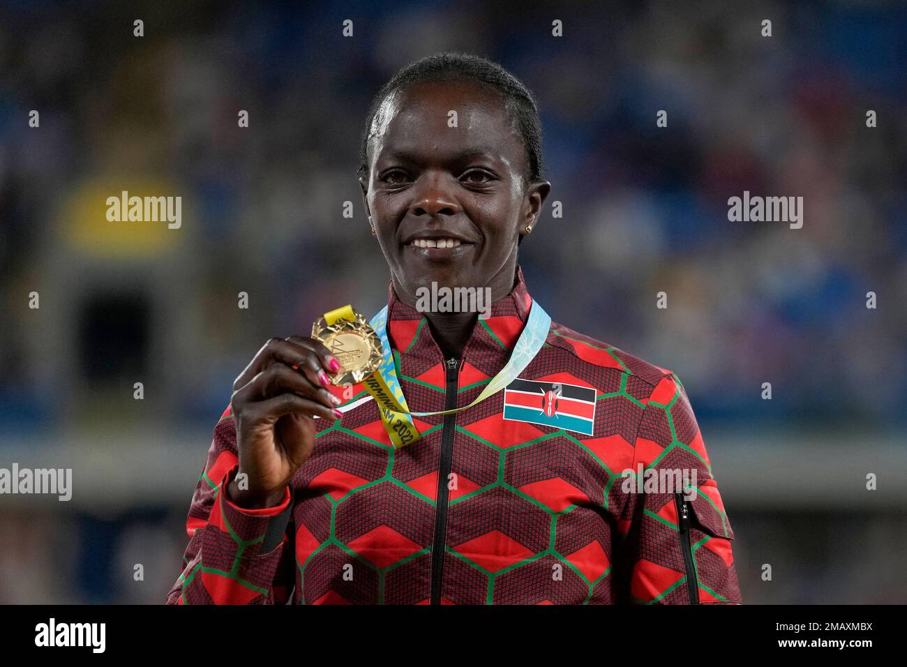 Mary Moraa of Kenya poses on the podium after winning the gold medal in ...