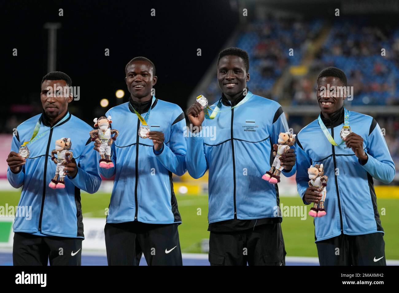 Team Botswana poses on the podium after winning the silver medal in the ...