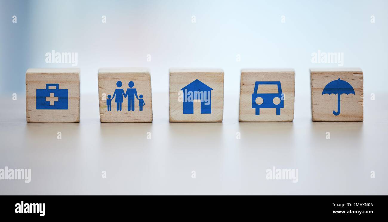 Medical, house and life insurance on blocks background for family ...