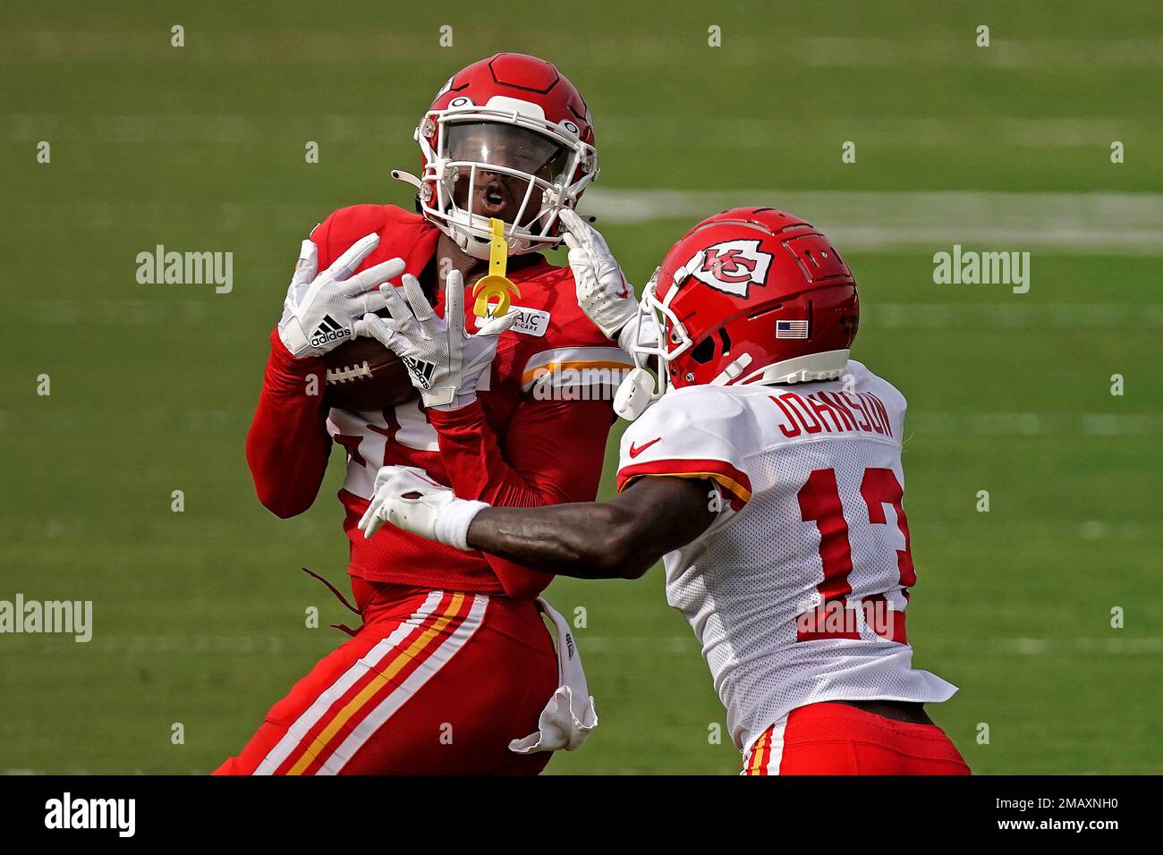 Kansas City Chiefs wide receiver Omar Bayless, left, catches a pass ...