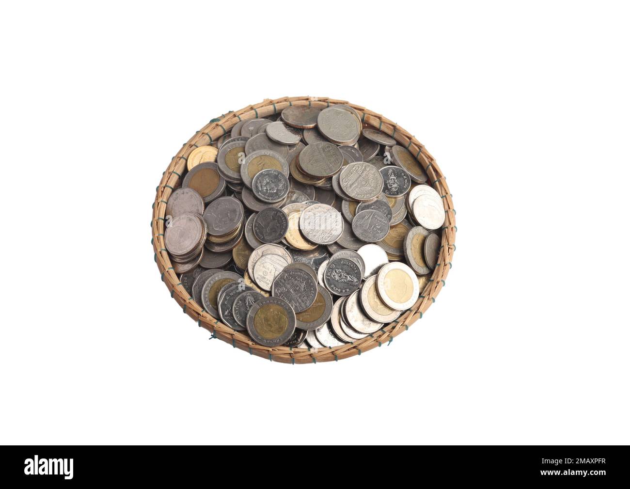 Coins in a bamboo basket on a white background.Saving money concept ...