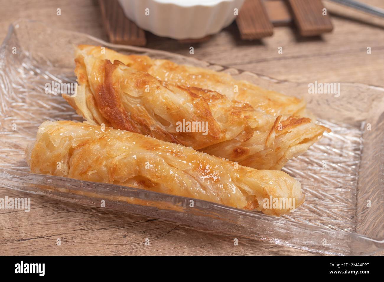 Fried Roti with Sweetened Condensed Milk Thai Dessert Stock Photo - Alamy