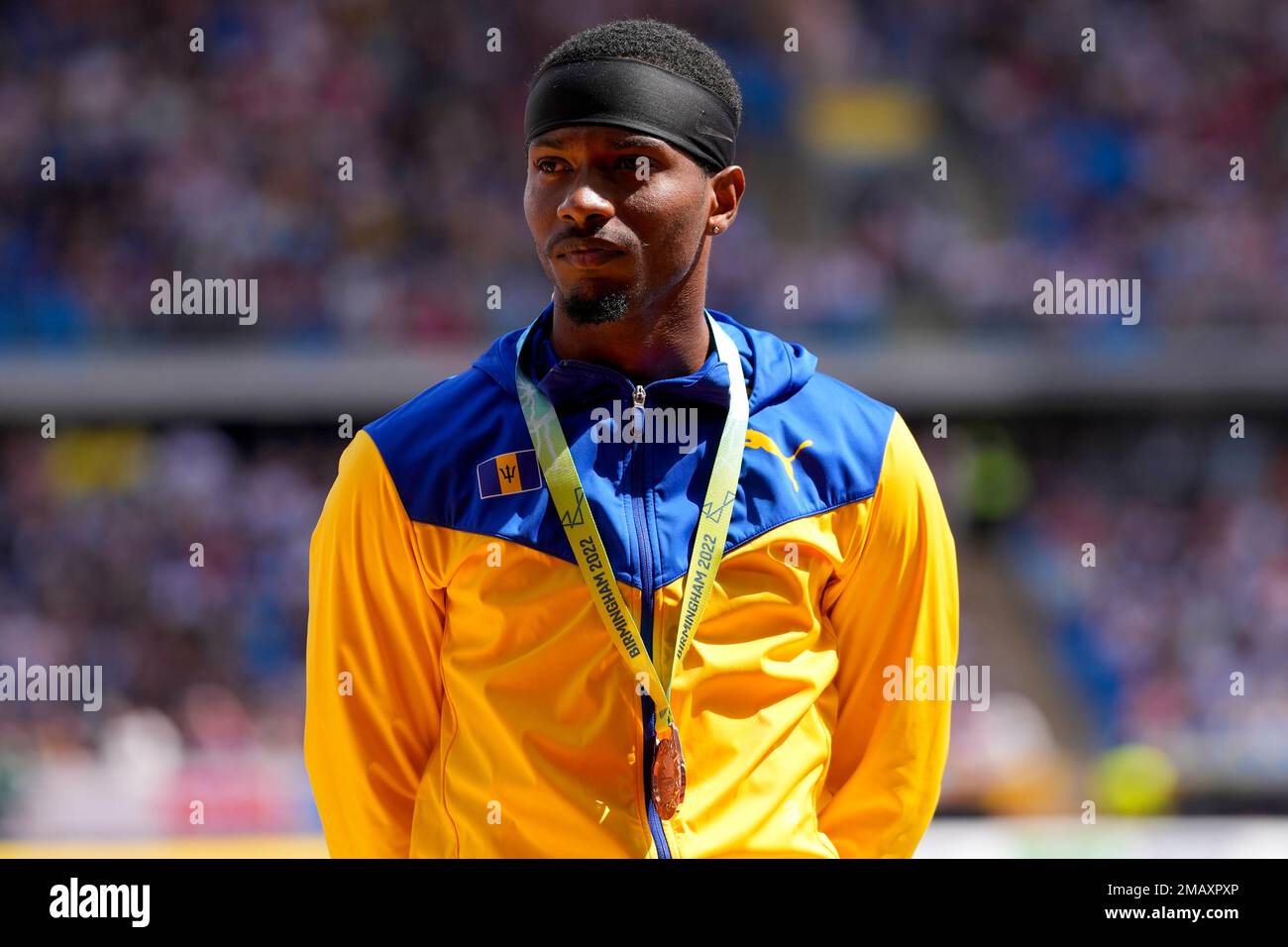 Men's 400 meters bronze medalist Jonathan Jones of Barbados stands on ...