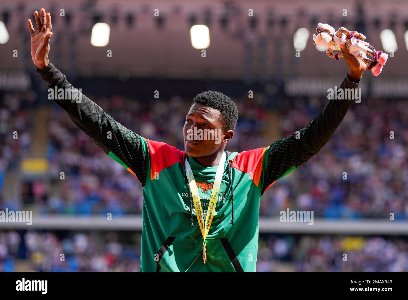 Men's 400 meters gold medalist Muzala Samukonga, centre, of Zambia ...