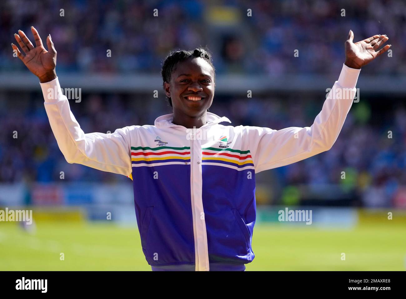 Women's 200 meters bronze medalist Christine Mboma, of Namibia waves on ...
