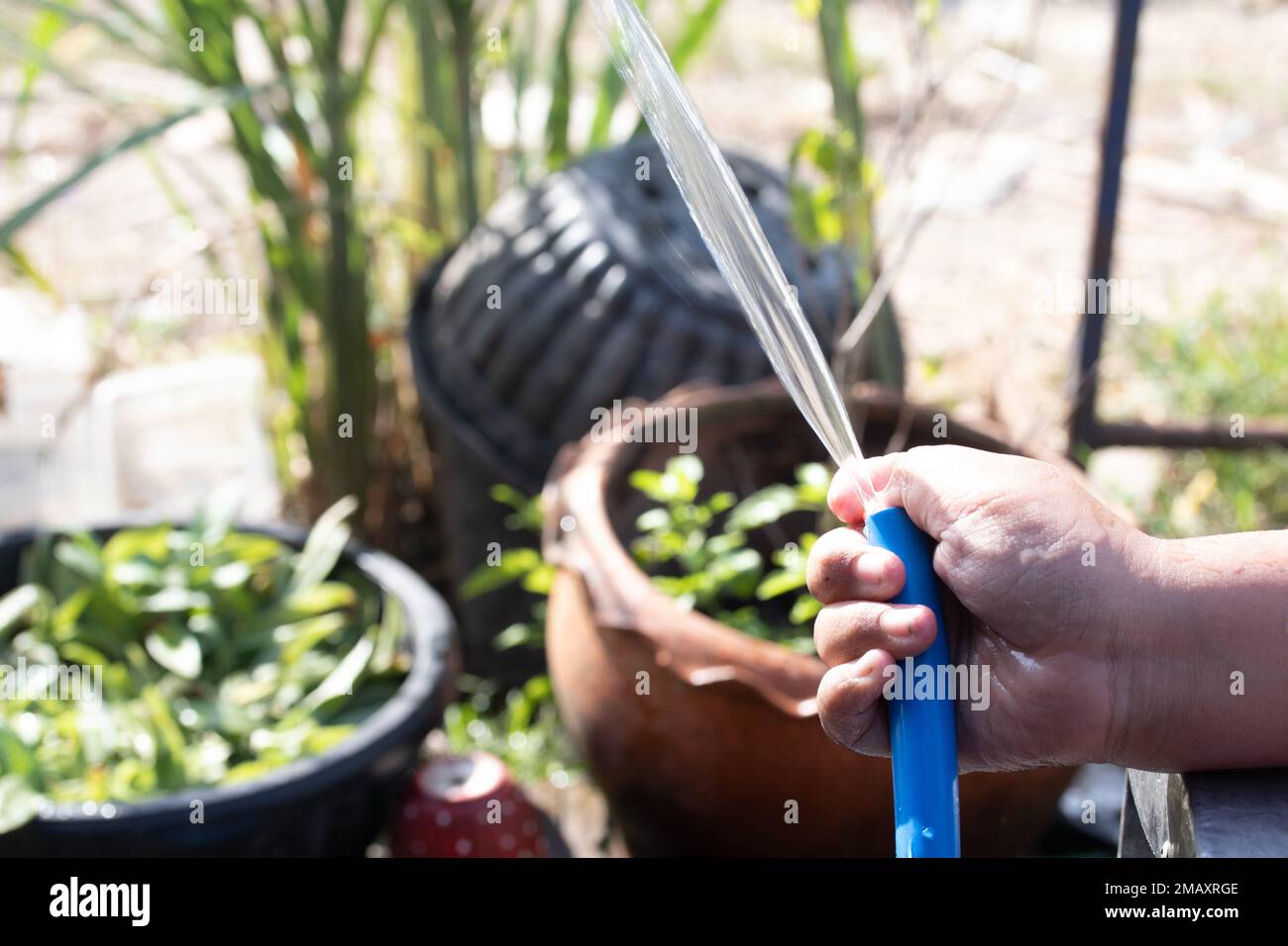 Water flowing from the stream, nature background Stock Photo - Alamy