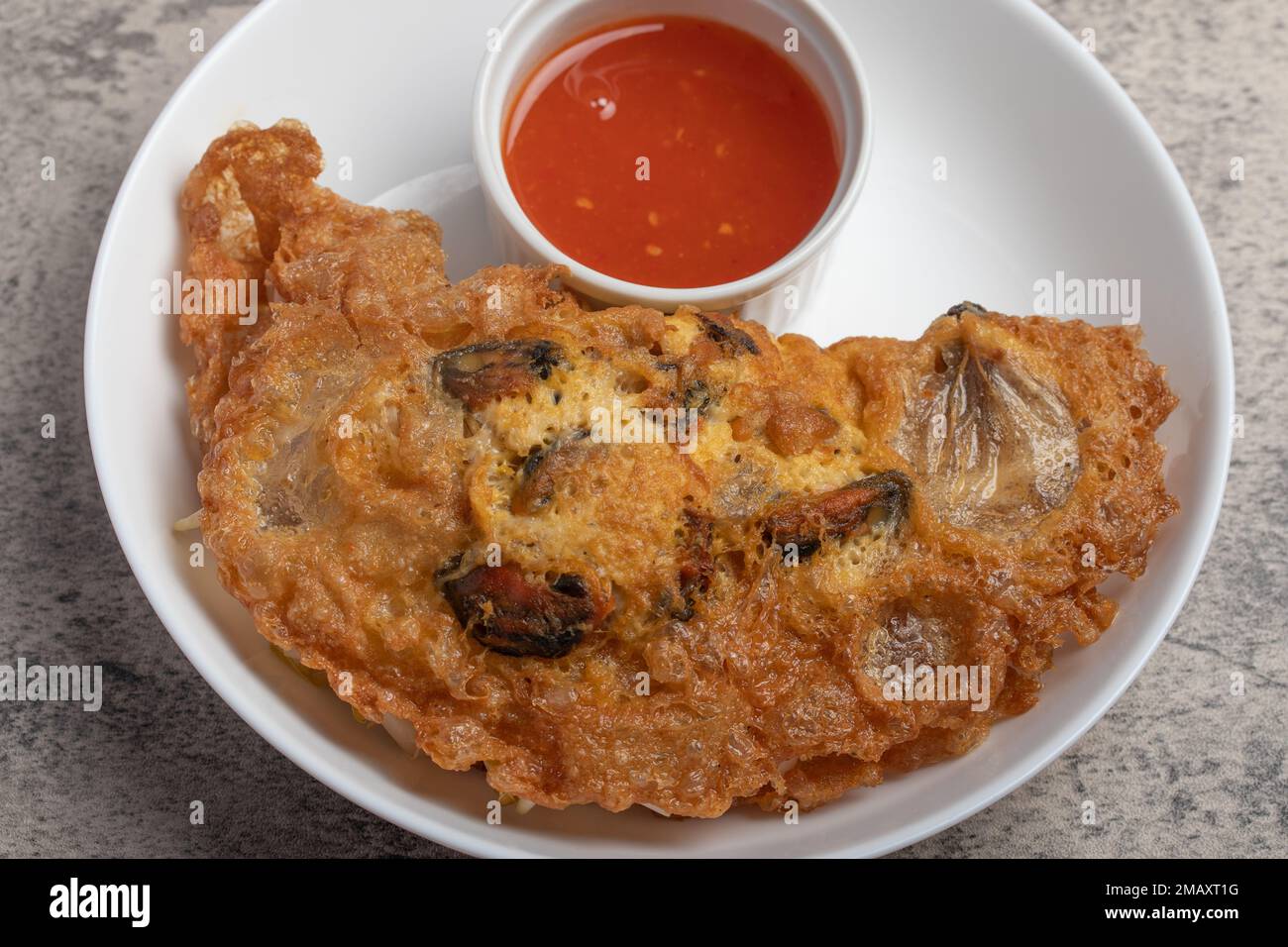 Fried mussels in crispy batter in a white plate Stock Photo - Alamy
