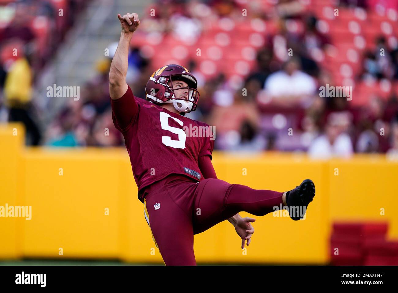 Washington Commanders punter Tress Way (5) punts the ball during an NFL ...