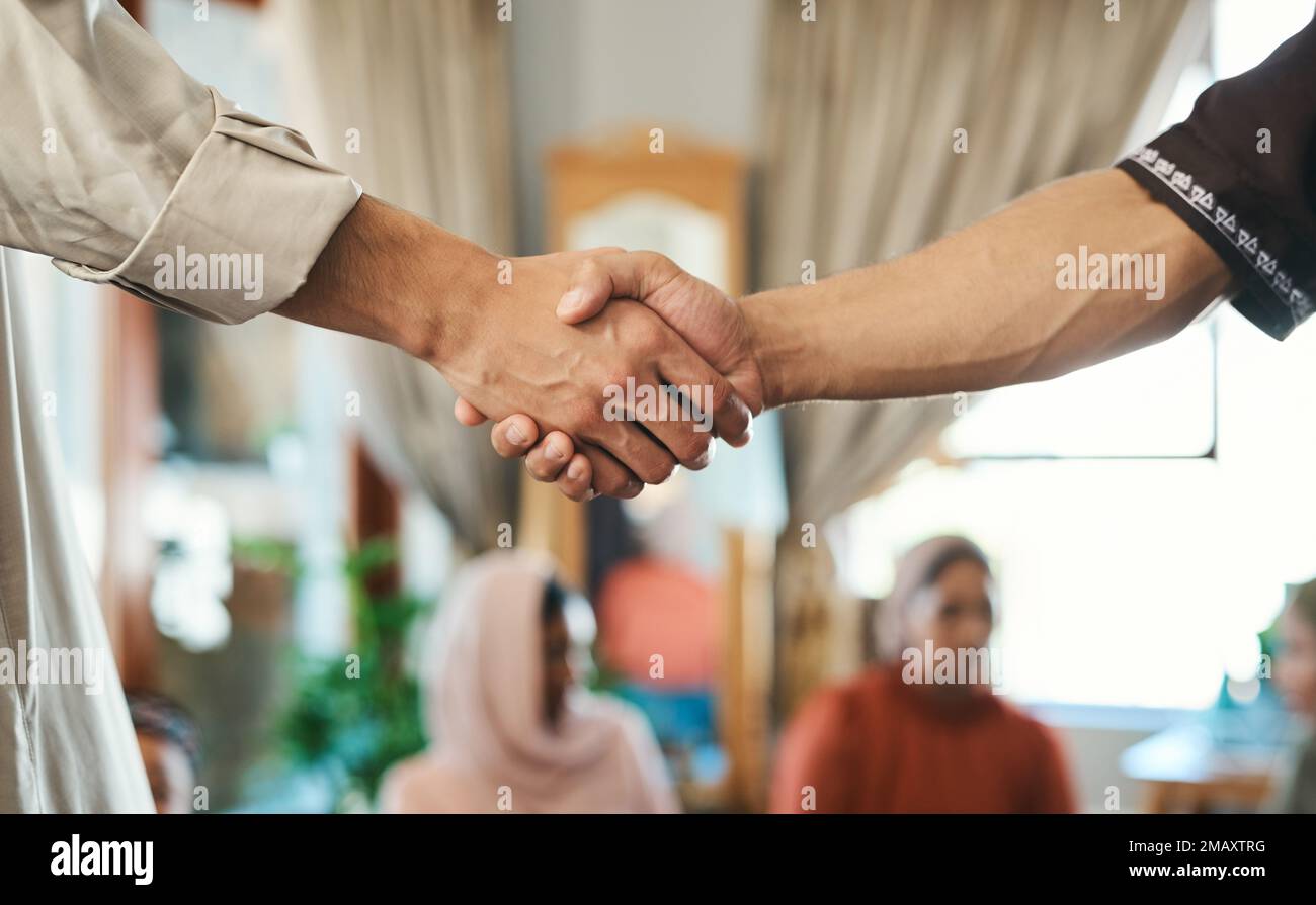 Its so good to see you again. two muslim men shaking hands in greeting ...
