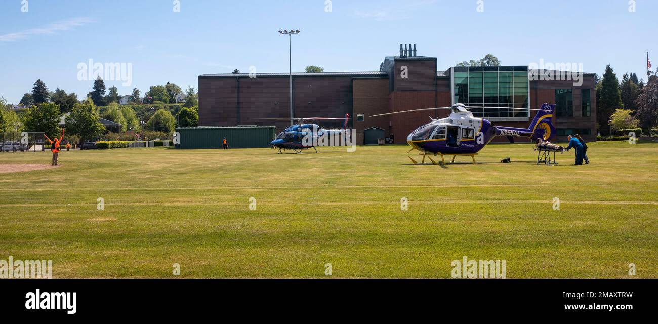 Flight nurses from Air Lift North West move a Sailor into a helicopter ...