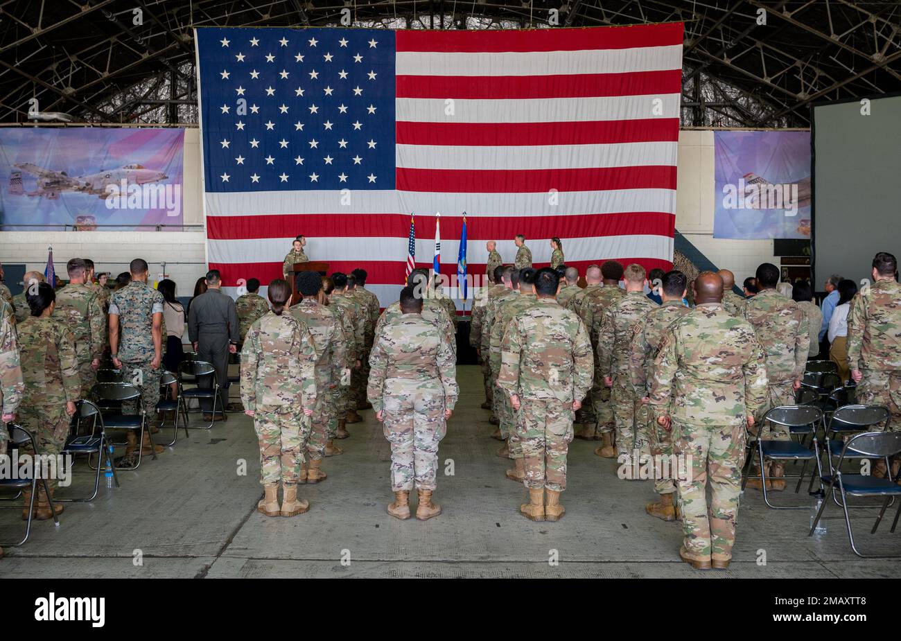 51st Operations Group members stand at attention for the singing of the ...