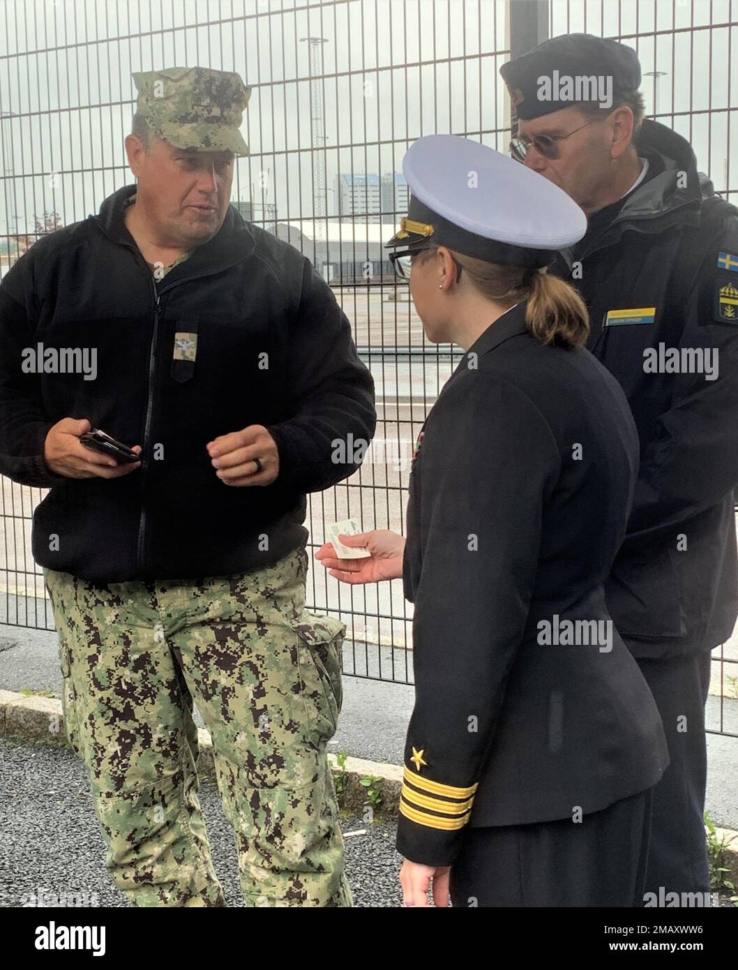 Capt. Douglas S. MacKenzie (left), Naval Supply Systems Command Fleet Logistics Center Sigonella ...