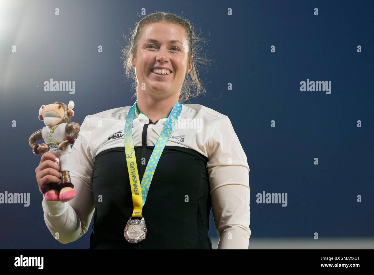 Silver medalist Julia Ratcliffe of New Zealand poses on the podium ...