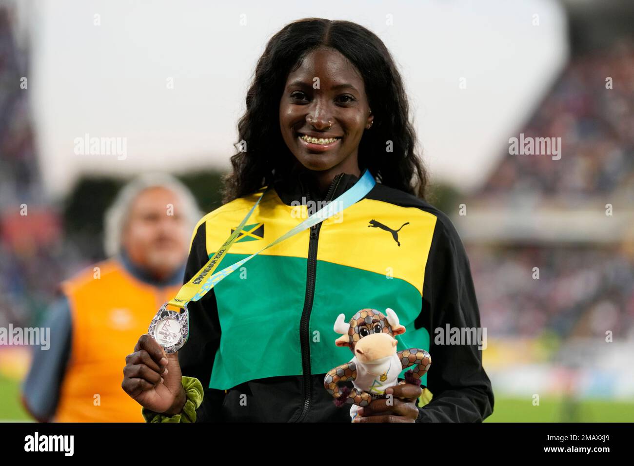 Shiann Salmon of Jamaica poses on the podium after winning the silver ...
