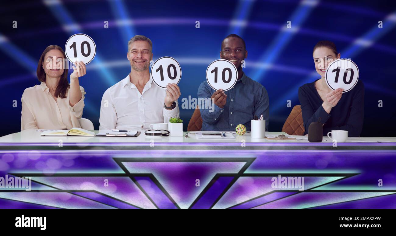 Happy Panel Judges Sitting In Front Of Red Curtain Showing 10 Score ...