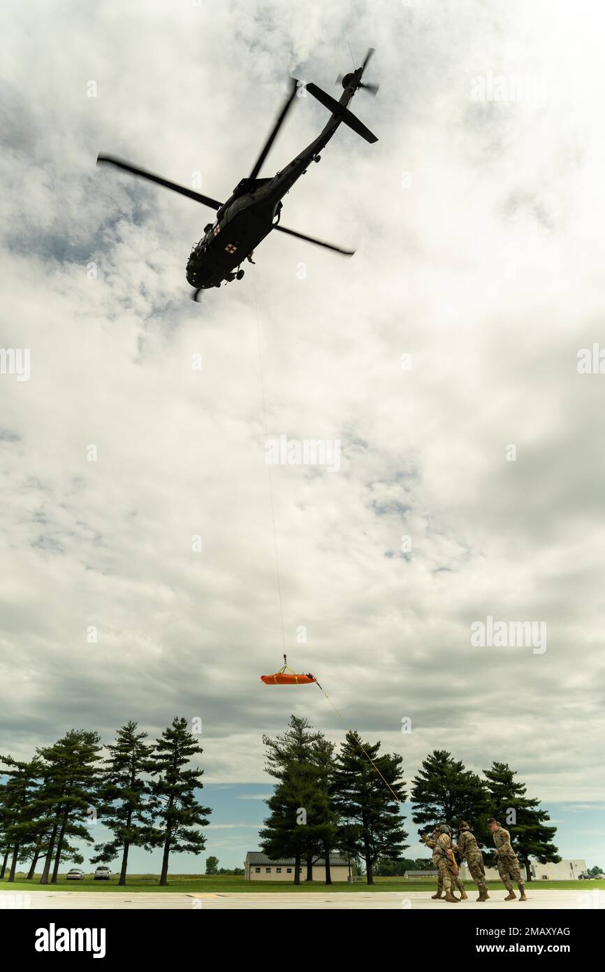 The Missouri National Guard MedEvac Team lift a casualty in their Black ...
