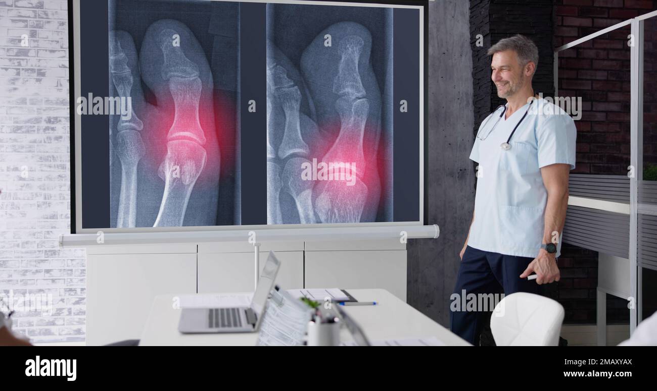 Doctors And Radiologists Discussing X-ray Images Of Patient Stock Photo ...