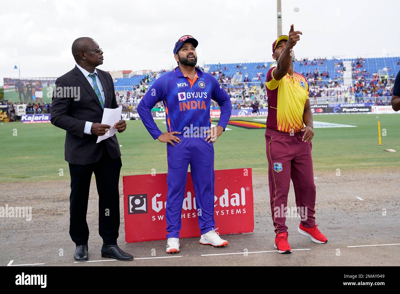 India's captain Rohit Sharma, center, and West Indies captain Nicholas ...
