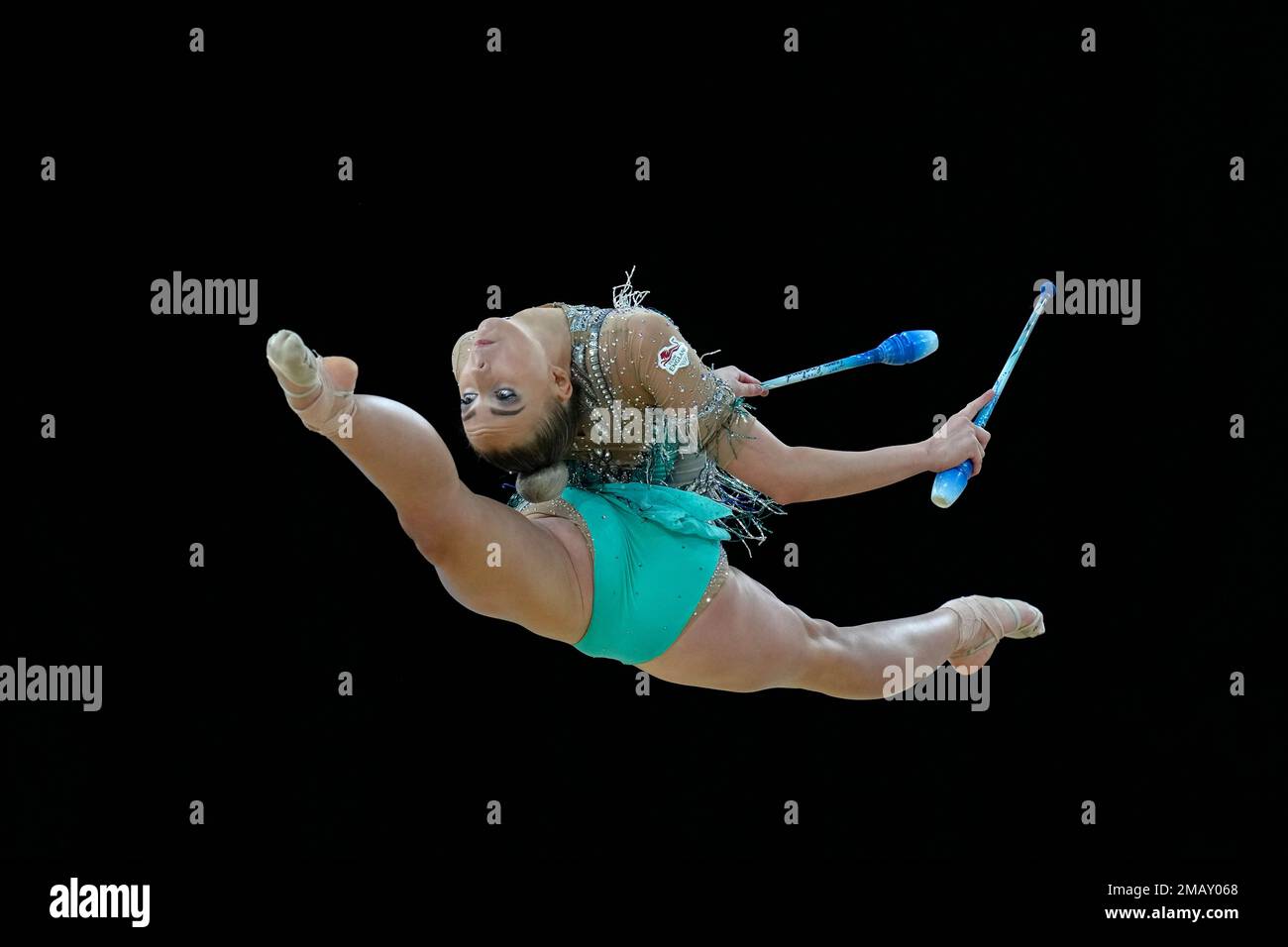 Saffron Severn of England performs with the clubs in the Apparatus ...