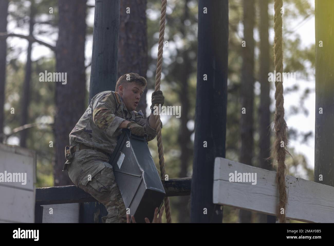 Cpl. Michael Mayfield, assigned to the 35th Signal Brigade, lifts an ...