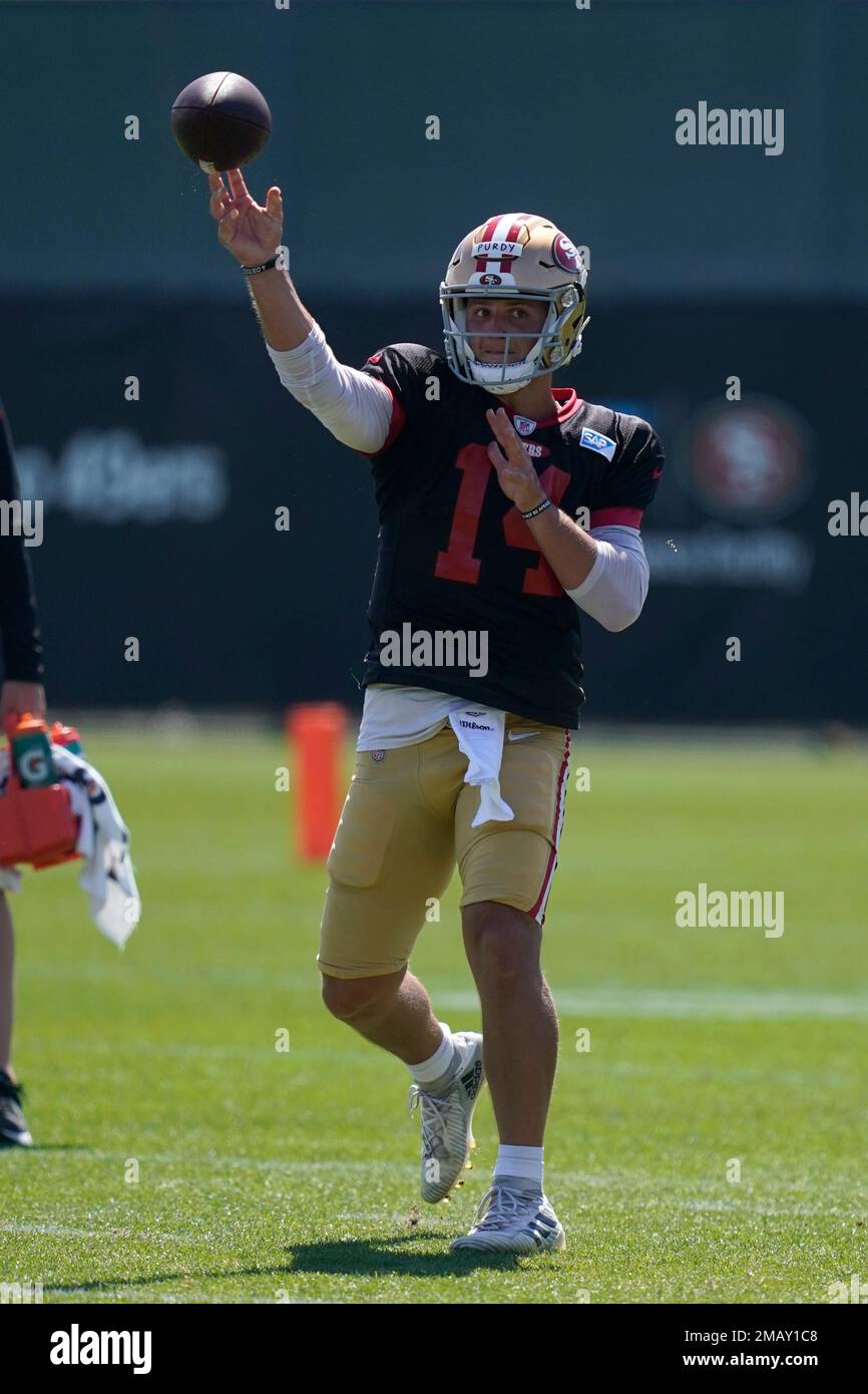 San Francisco 49ers quarterback Brock Purdy (14) takes part in drills ...