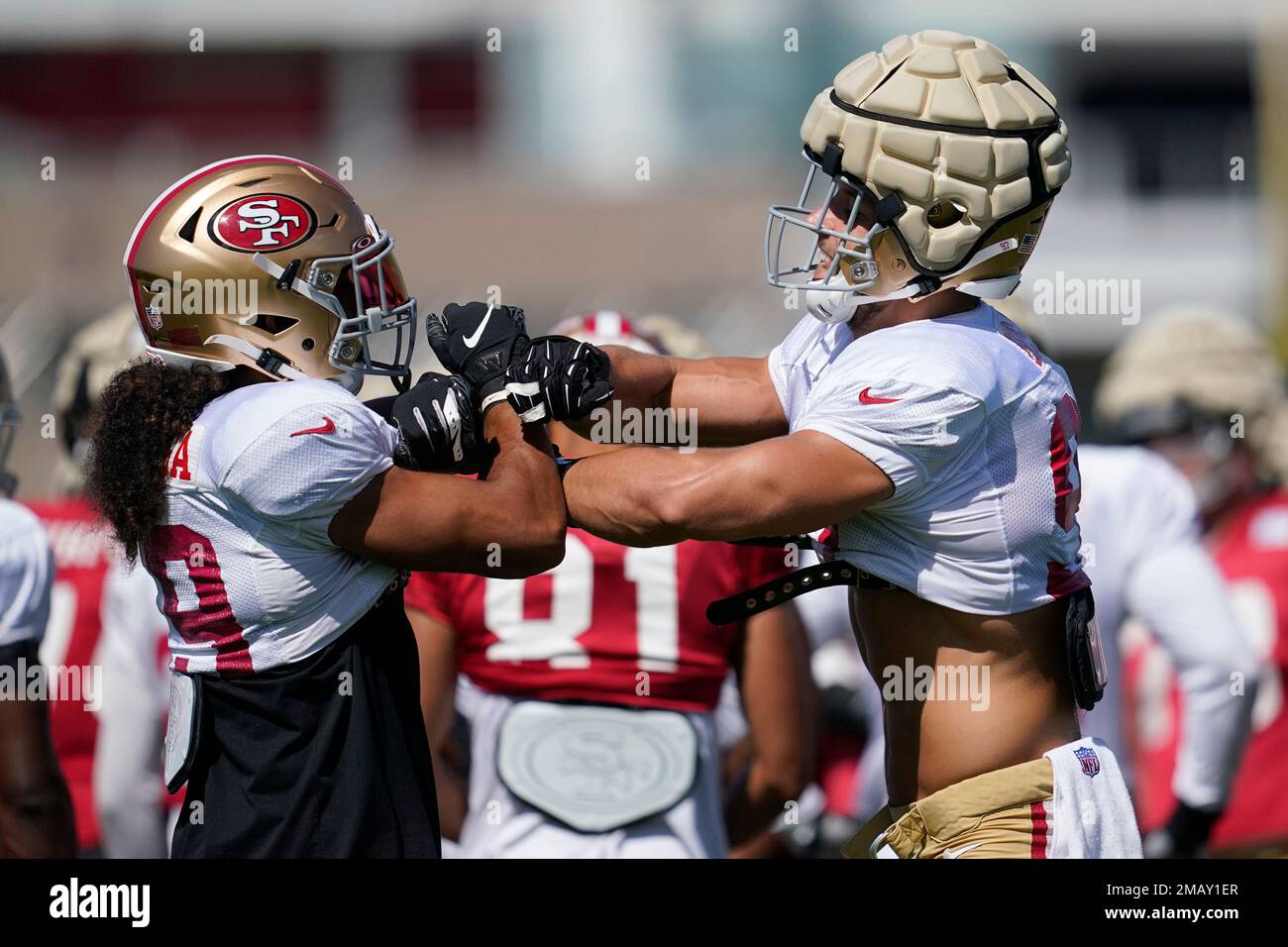 San Francisco 49ers safety Talanoa Hufanga, left, and defensive end ...