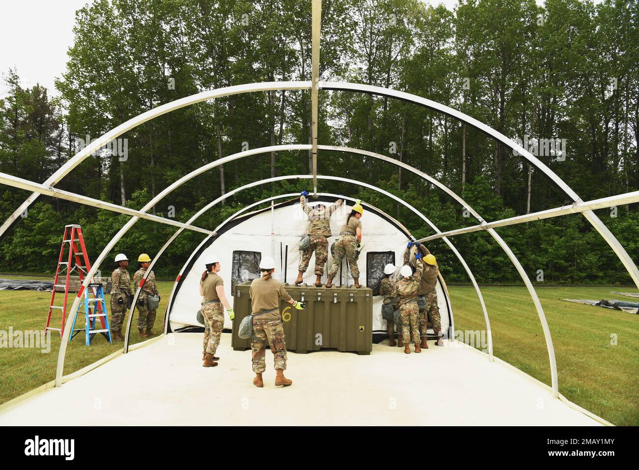 Airmen assigned to the 178th Wing Force Support Squadron construct a ...