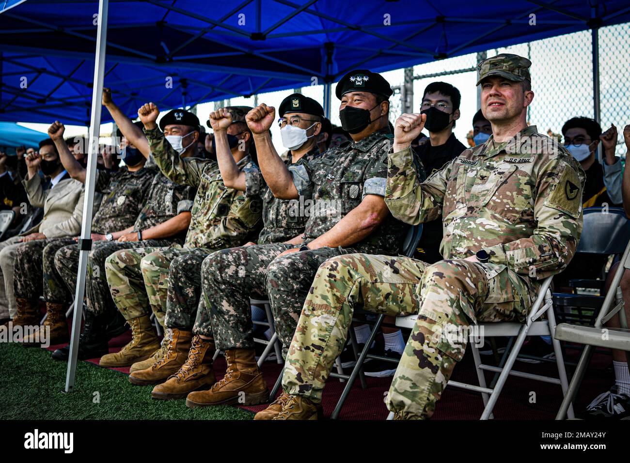 Service members cheer at Balboni Field during the opening ceremony for ...