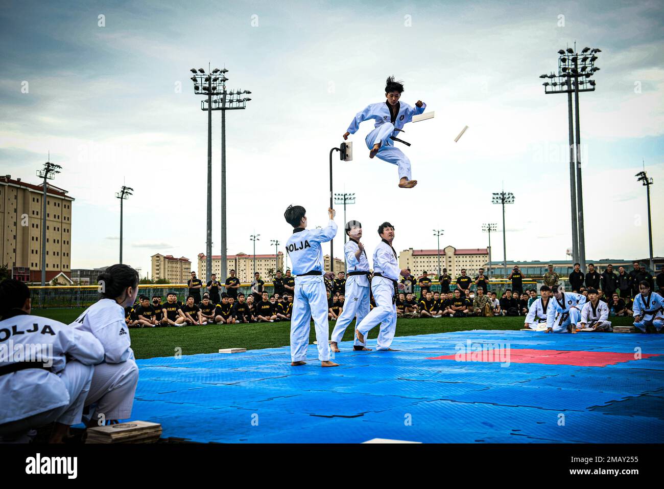 A taekwondo demonstration team performs at Balboni Field after the ...