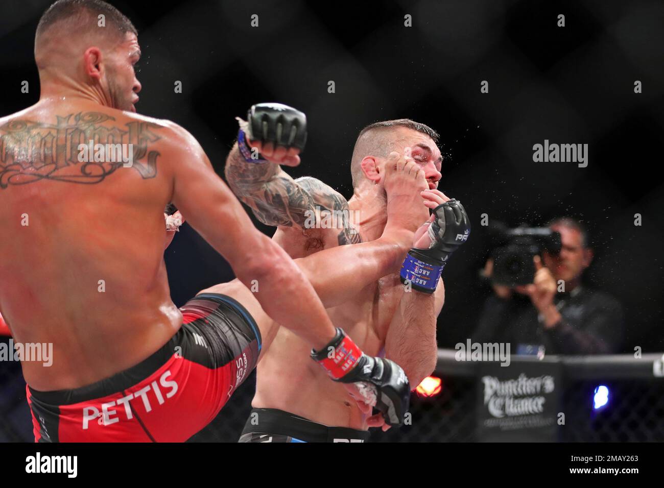 Anthony Pettis lands a kick to the face of Stevie Ray during their ...