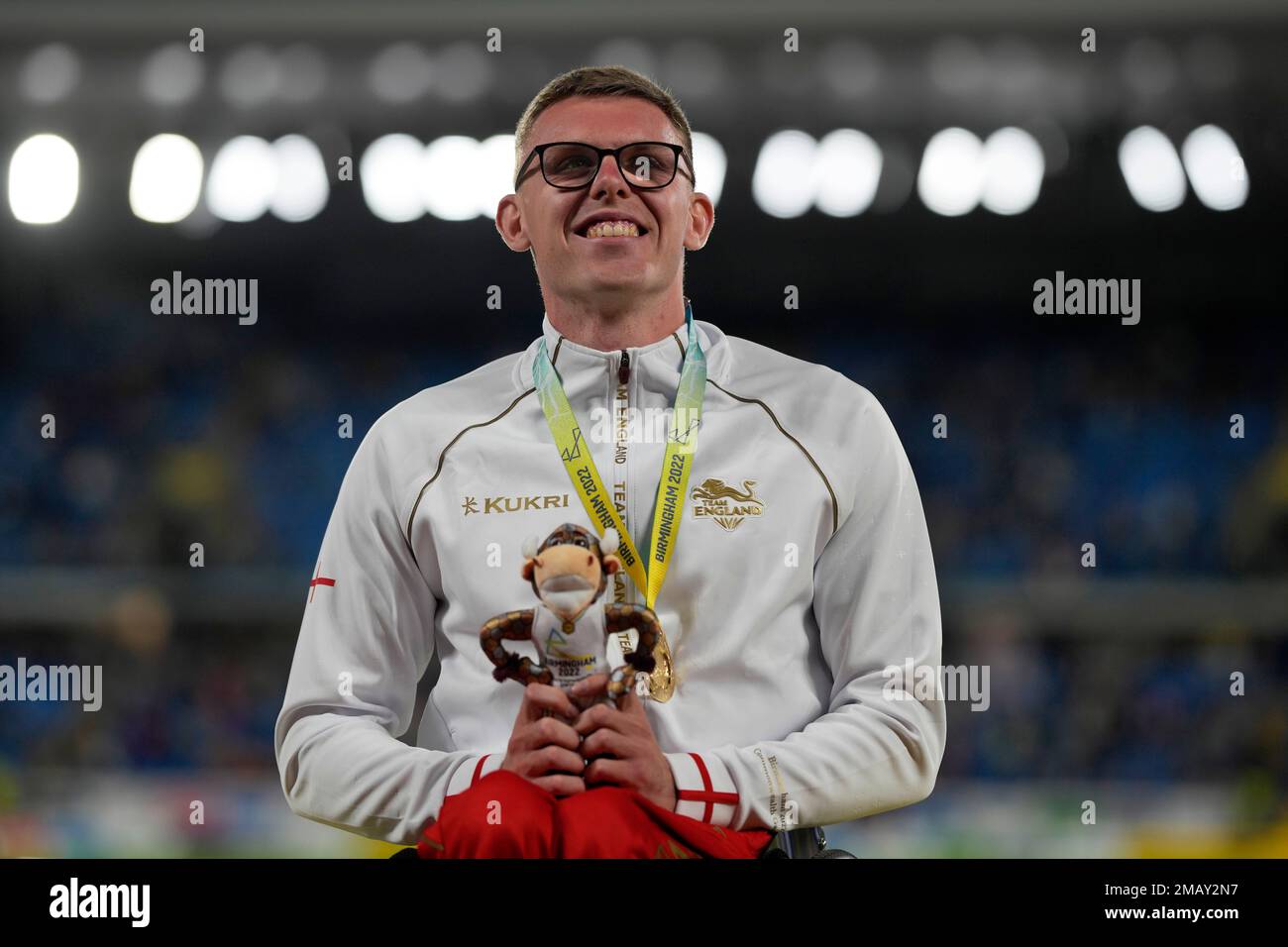 Nathan Maguire of England poses on the podium after winning the gold ...