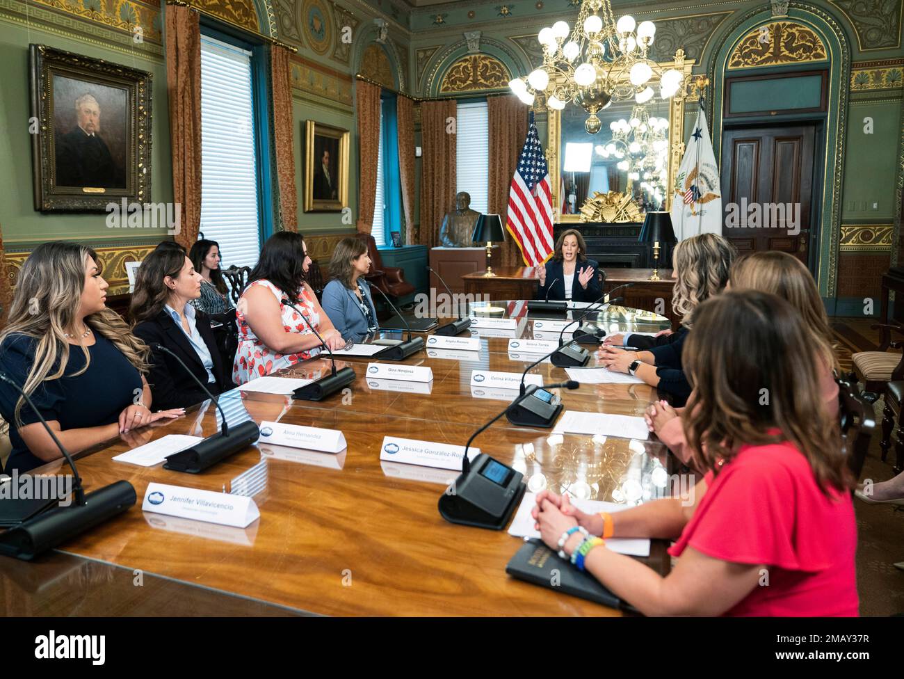 Vice President Kamala Harris, back center, speaks with Latina state ...