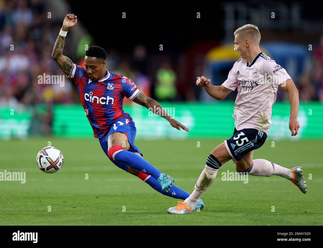 Crystal Palace's Nathaniel Clyne, left, duels for the ball with Arsenal ...