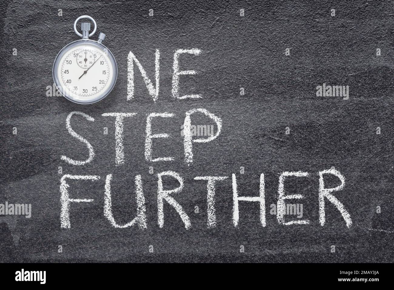 one step further phrase written on chalkboard with vintage precise ...