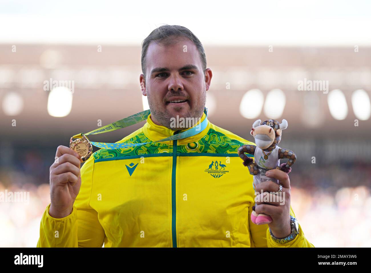 Matthew Denny of Australia poses on the podium after winning the gold ...