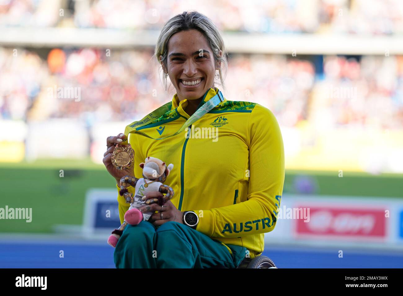 Madison de Rozario of Australia poses on the podium after winning the ...