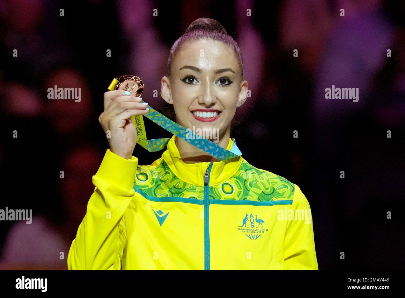Alexandra Kiroi-Bogatyreva of Australia holds up her bronze medal after ...
