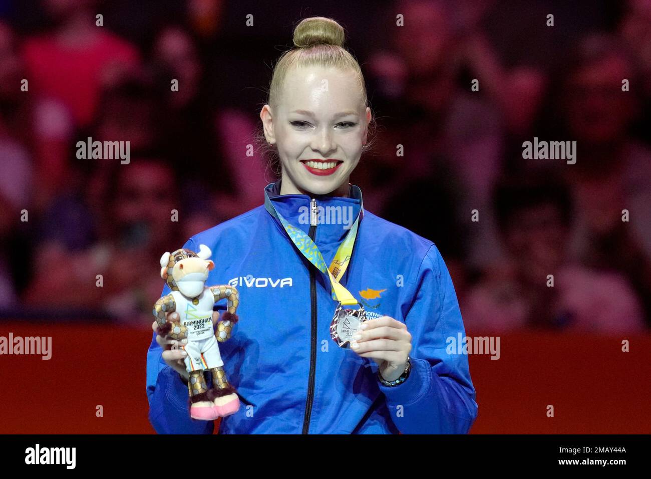 Anna Sokolova of Cyprus holds up the silver medal after placing second ...