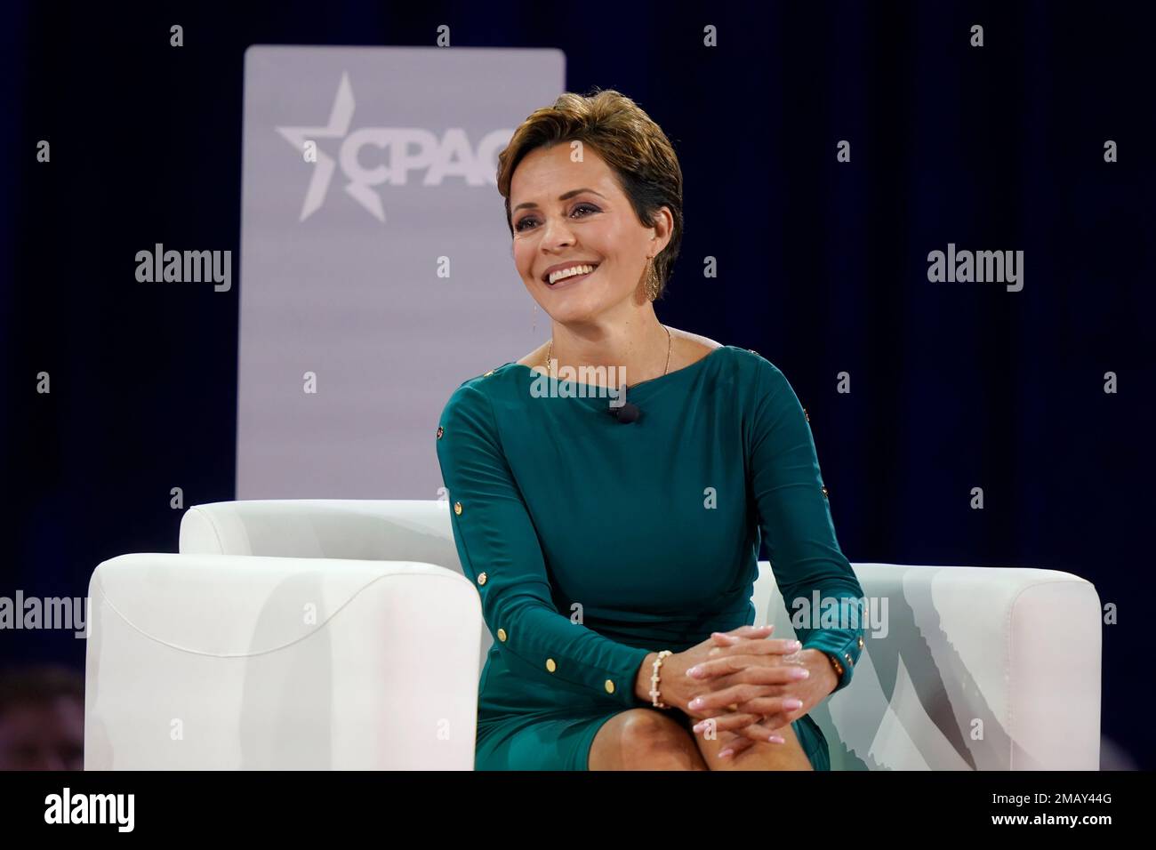 Kari Lake, Republican candidate for Arizona governor, smiles on stage ...