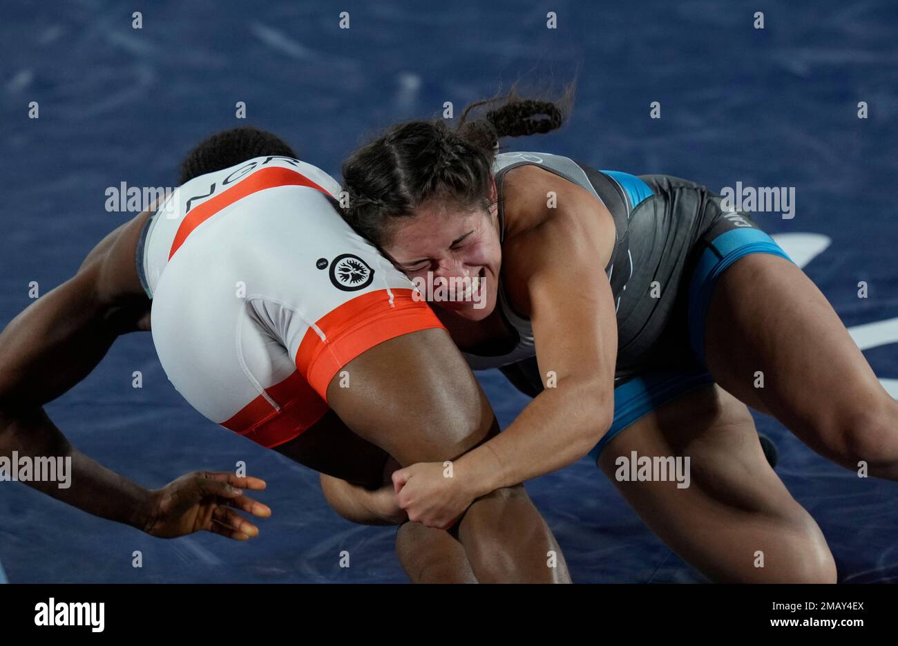 Canada's wrestler Ana Godinez ,right, wrestles with Nigeria's Esther ...